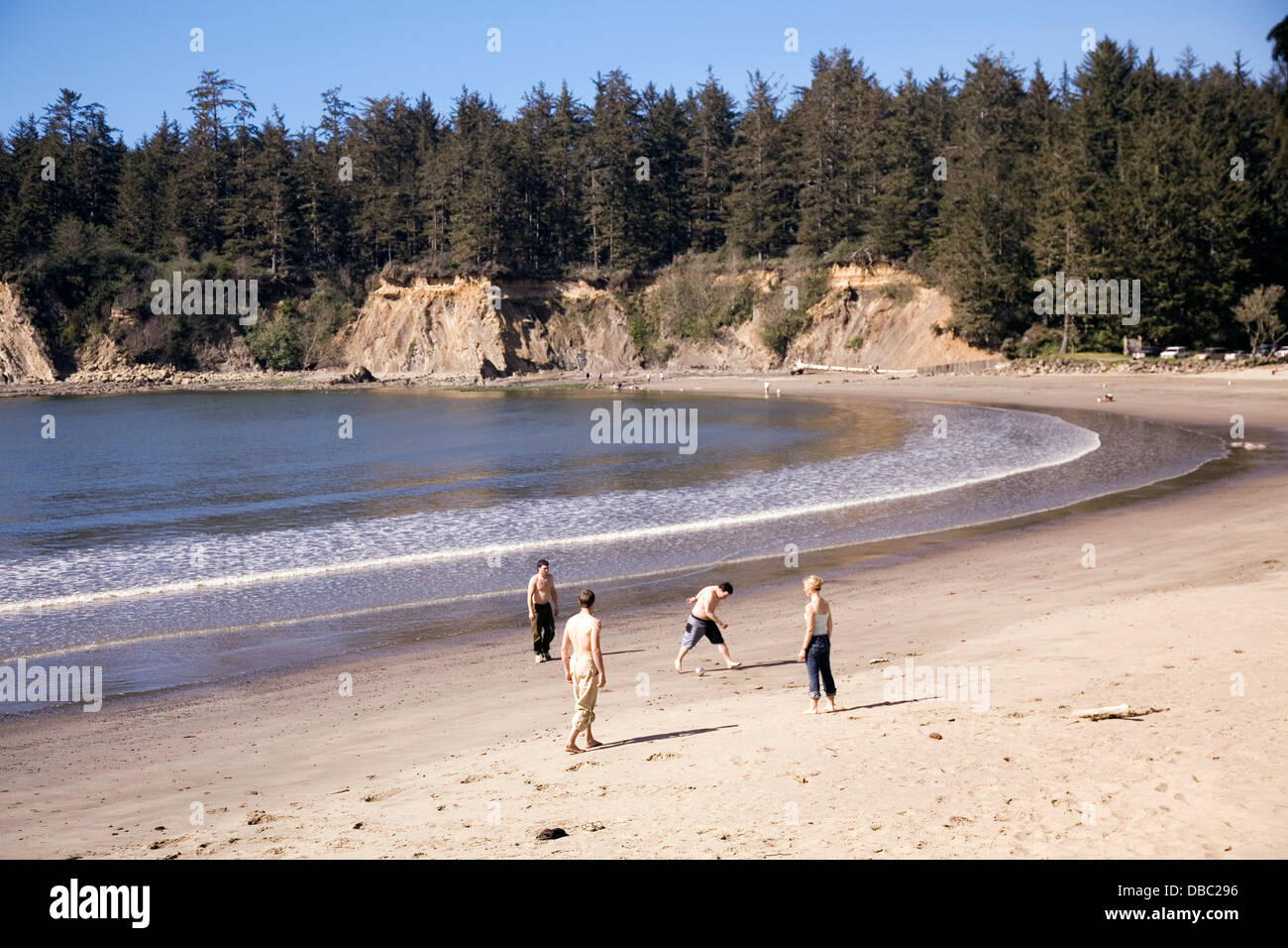 Youngsters Play Soccer On The Beach At Sunset Bay State Park Near Coos