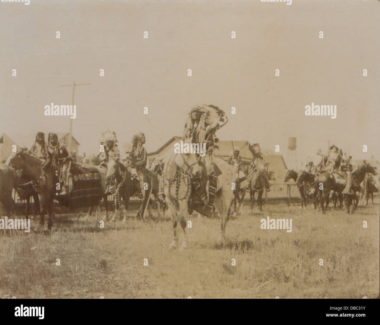 This photograph shows Chief Joe Healy with a group of braves, capturing ...