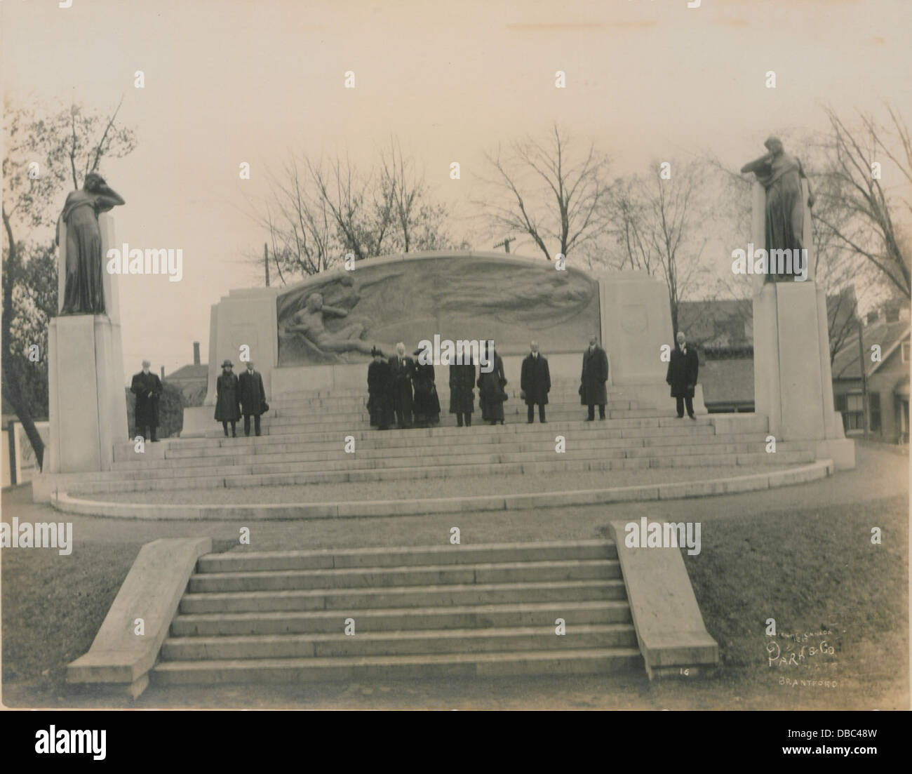 Dr. Bell and a committee are pictured in front of the Bell Memorial ...