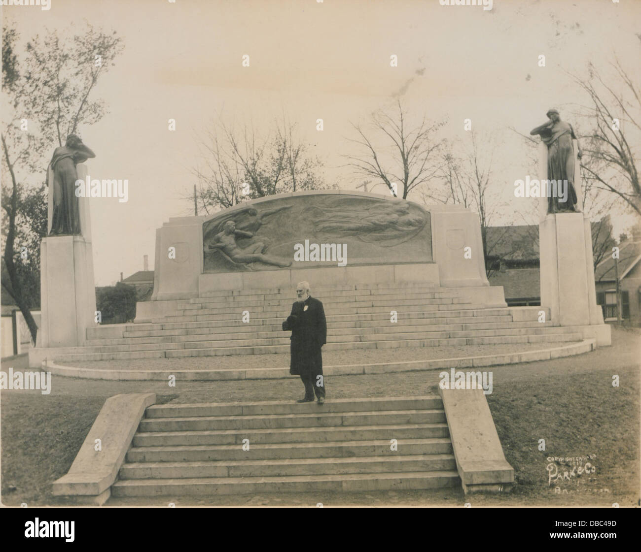 Dr. Bell stands in front of the Bell Memorial, a tribute to his ...
