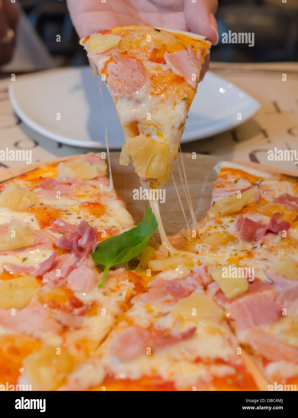 Pizza slice hand hi-res stock photography and images - Alamy