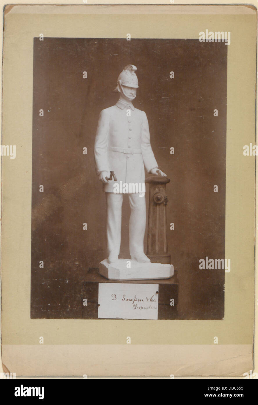 A photograph of a fireman in full uniform, likely taken in the early ...