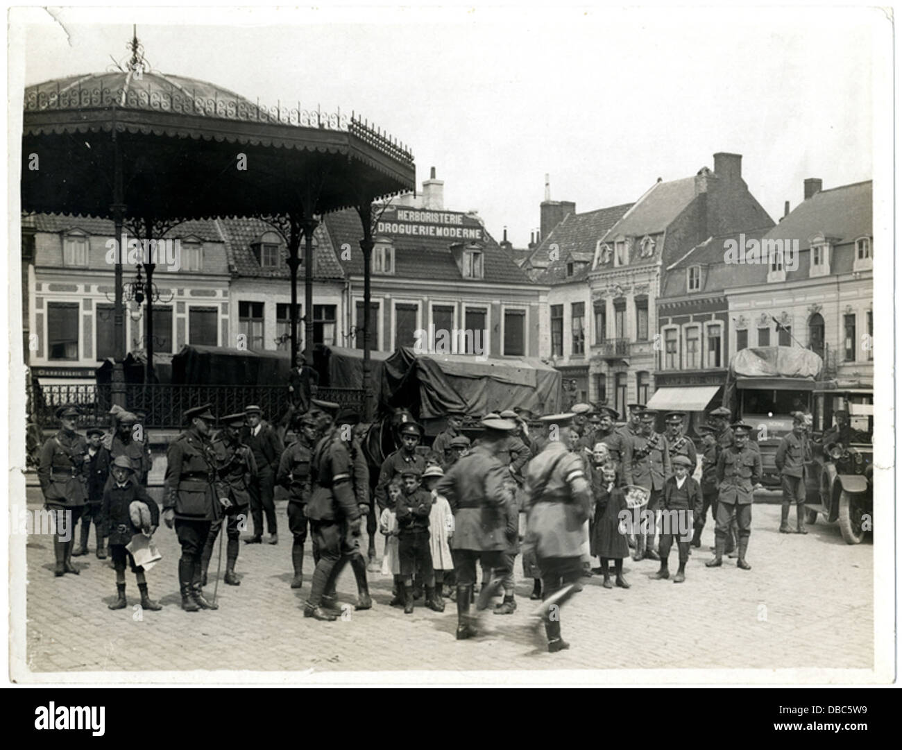General Sir J. Willcocks is seen walking in the French town of Merville ...