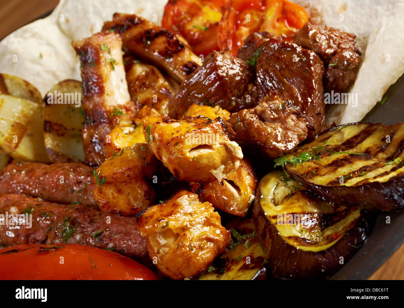 Shashlik (shish kebab). Various types mat roasted with vegetable ...