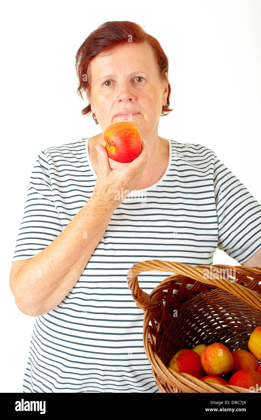 senior woman holding fresh apple Stock Photo - Alamy