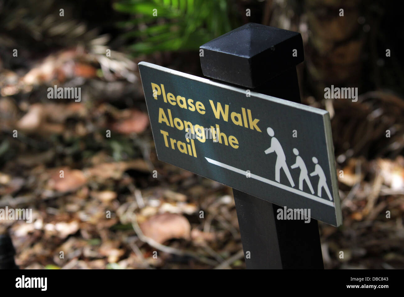 Please walk along the trail sign Stock Photo - Alamy