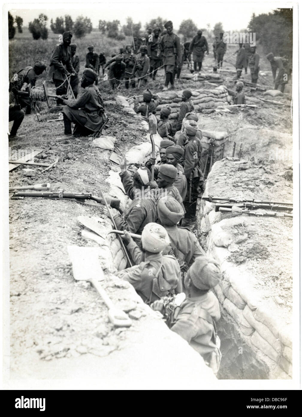 This image shows Indian infantry soldiers digging trenches in ...