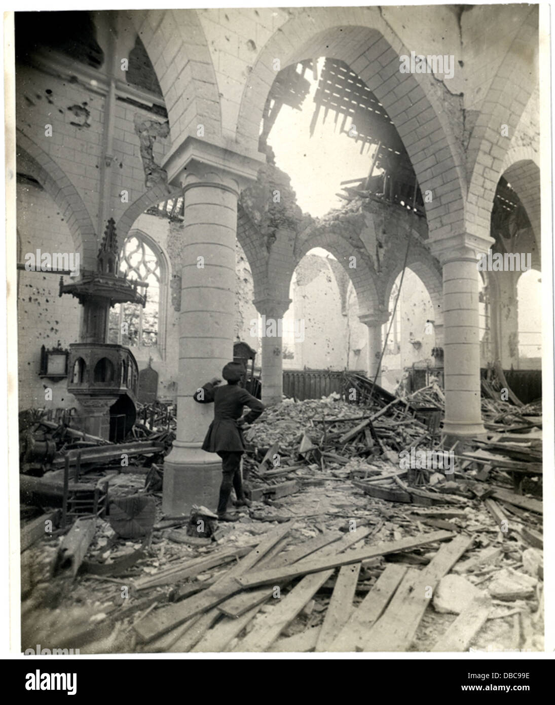 The image depicts the interior of a church destroyed by German ...