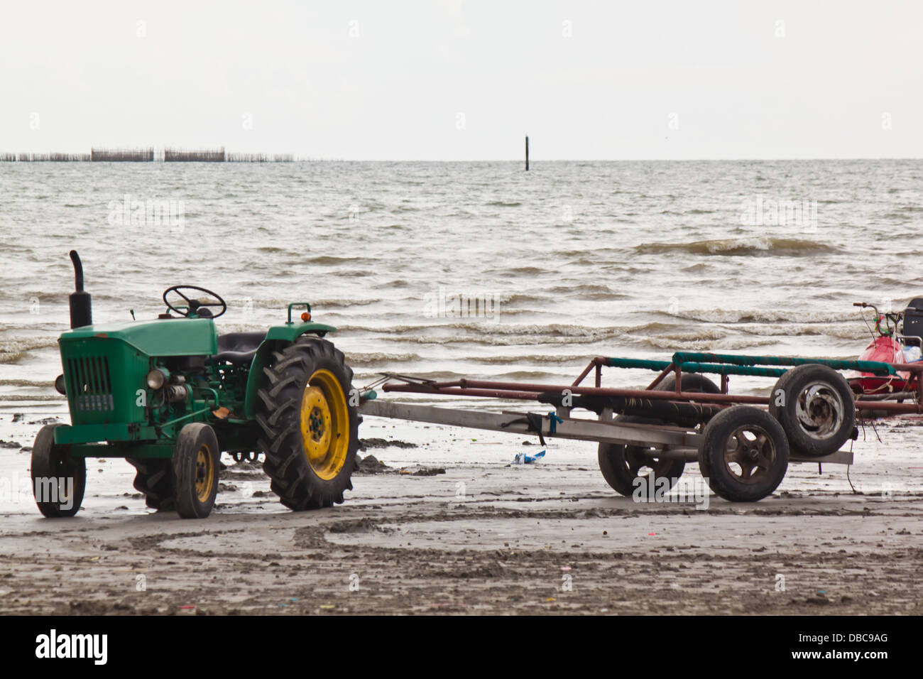 Tractor on beach Stock Photo - Alamy