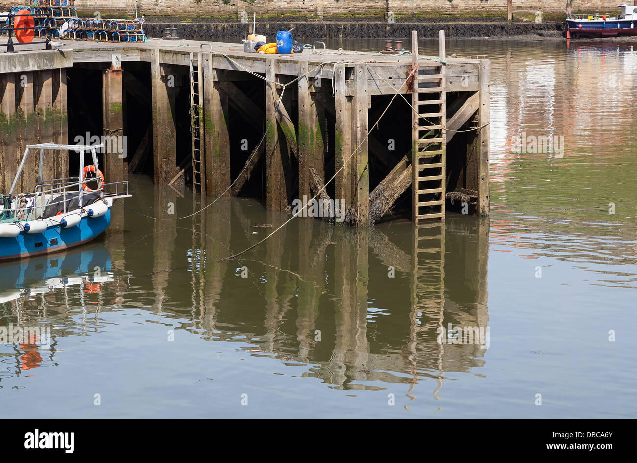 Old jetty at Whitby showing a ladder down to the water's edge Stock ...