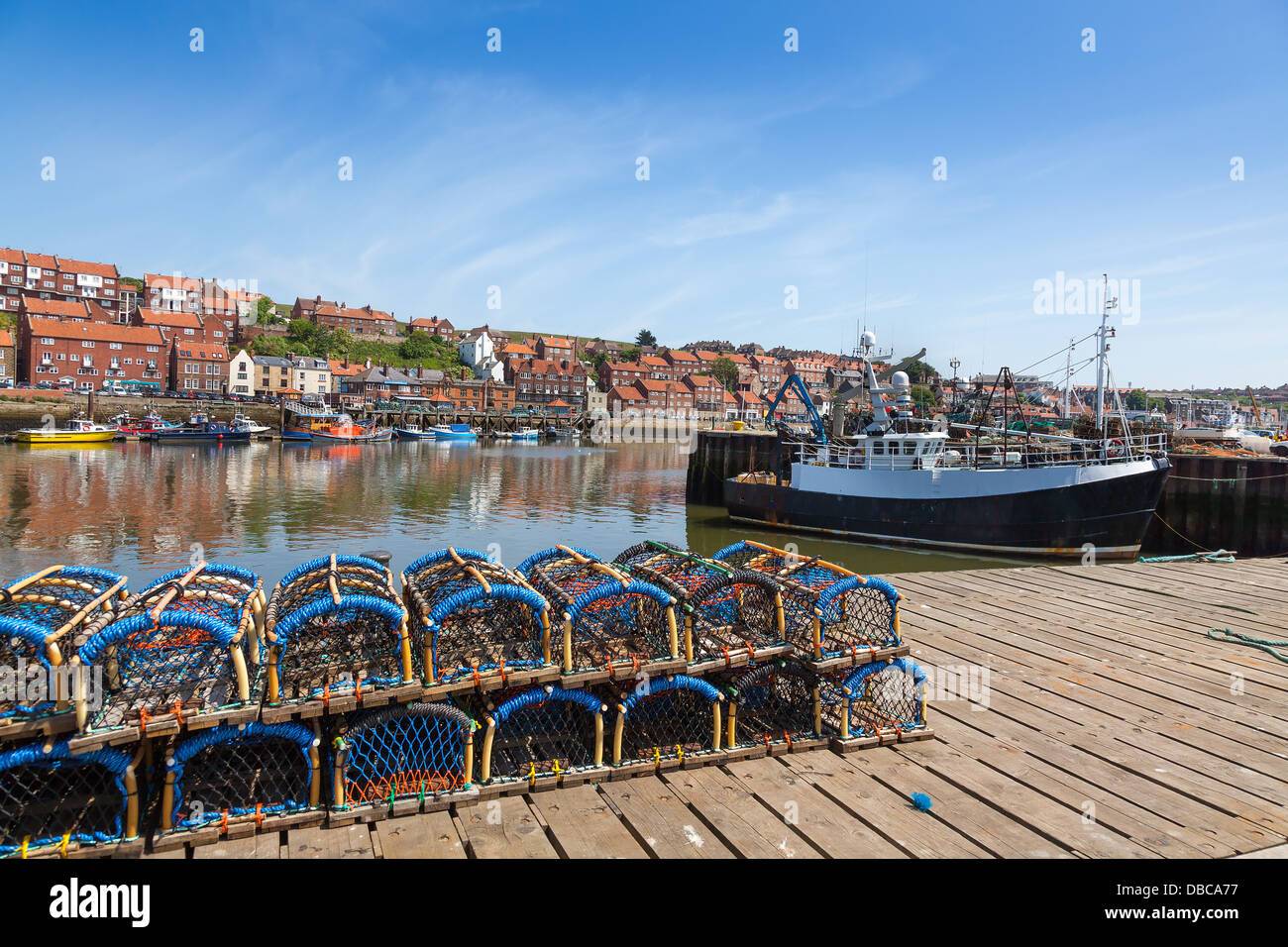 Whitby fishing harbor with lobster pots lining the quay Stock Photo - Alamy