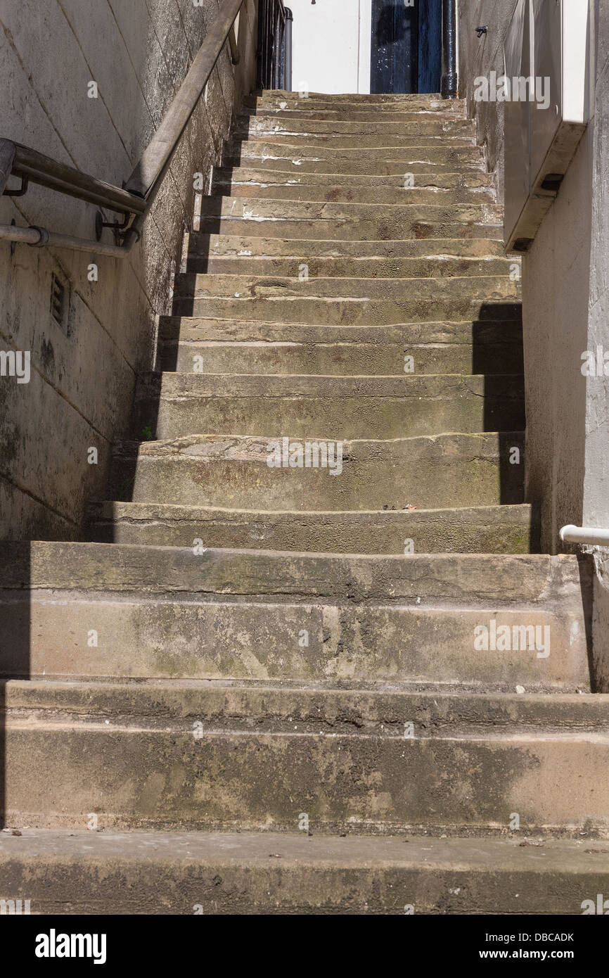 Stone steps rising vertically through an alleyway Stock Photo - Alamy