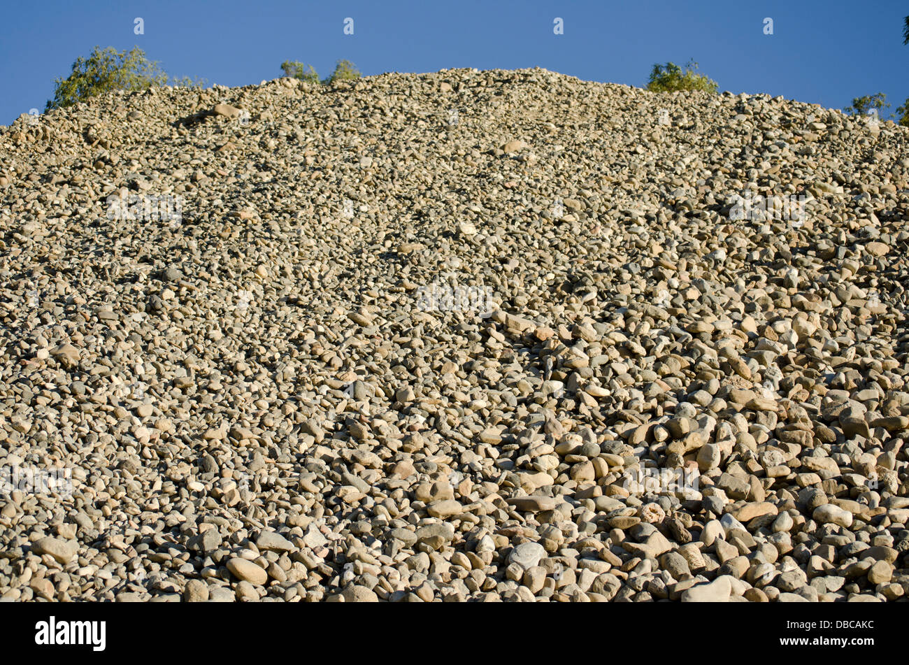 Pile of River stones after extraction out of river bed Stock Photo - Alamy