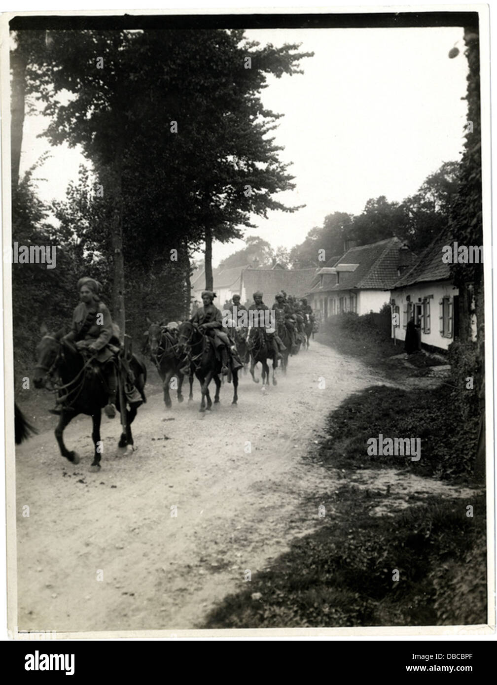 This photograph shows a cavalry brigade marching in Crecy, France. The ...