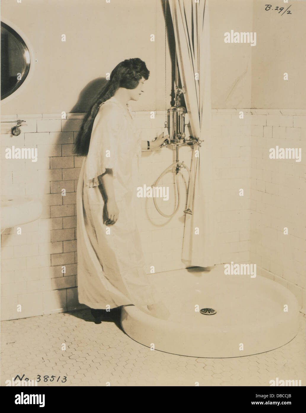 This photograph shows a living model posed alongside various plumbing ...