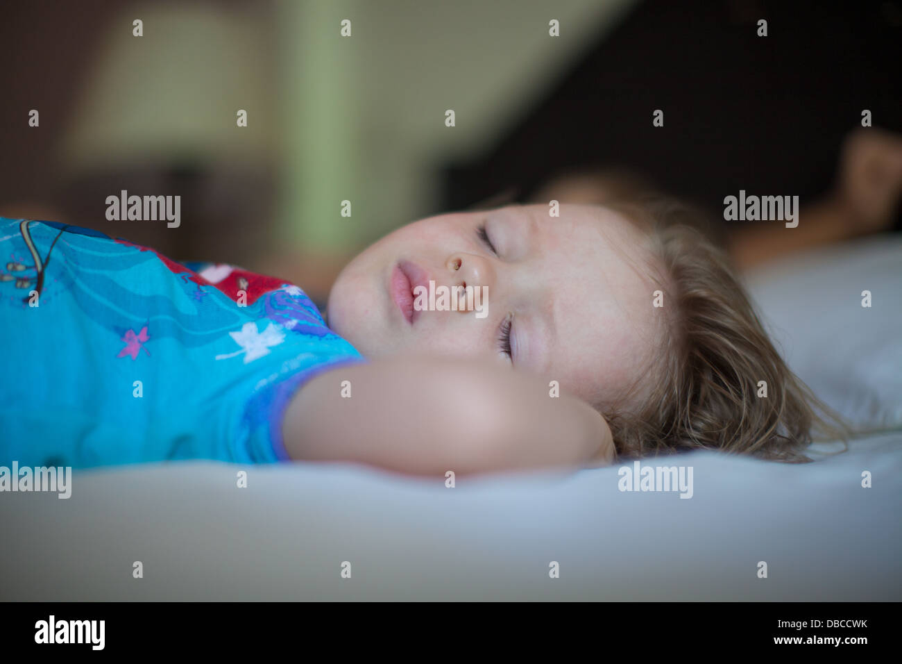 Adorable toddler taking a nap Stock Photo - Alamy