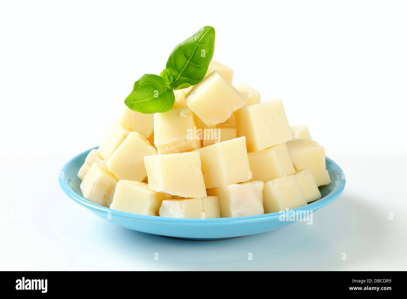 Heap of diced semi-firm cheese on plate Stock Photo - Alamy