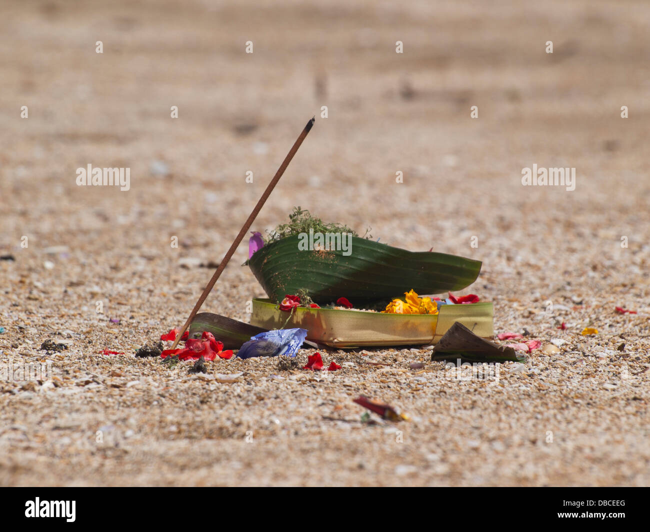 Hindu offerings in the beach sand, Kuta Stock Photo - Alamy