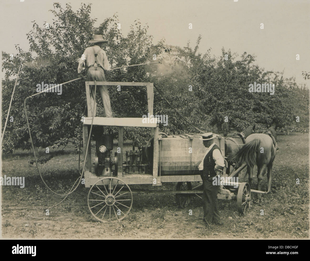 This image shows a power spraying machine, identified as No 14, being ...