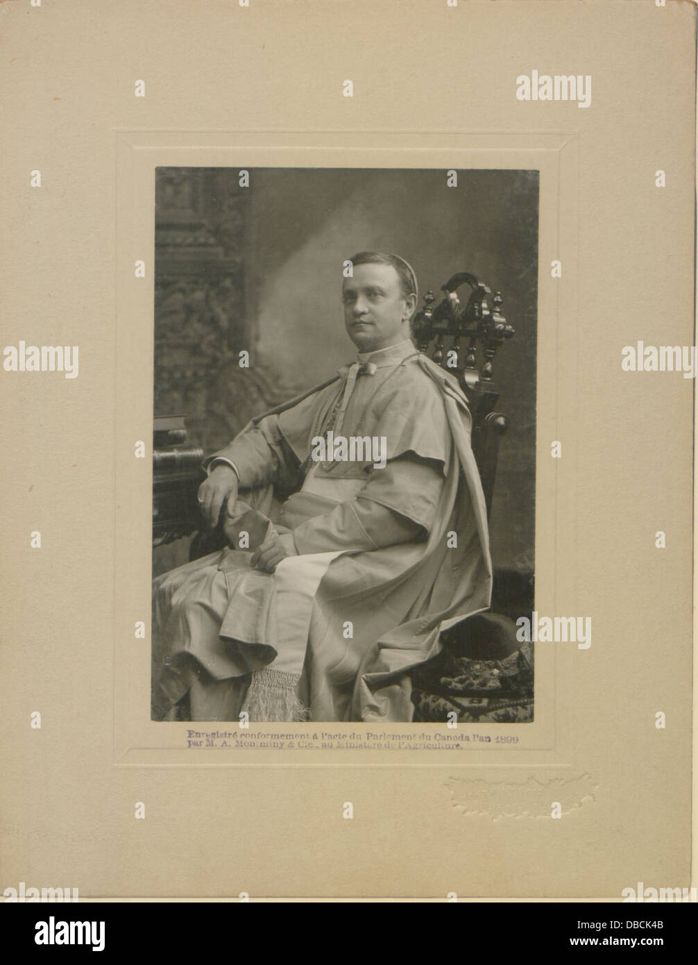 This photograph depicts Mgr. Falconio, a Roman Catholic figure, seated ...