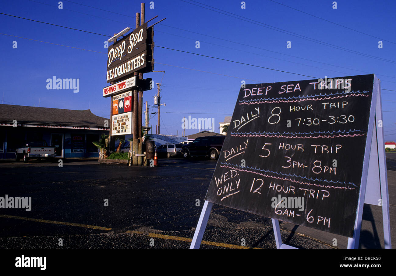 Signs advertising deep sea charter boat fishing at Port Aransas Texas ...