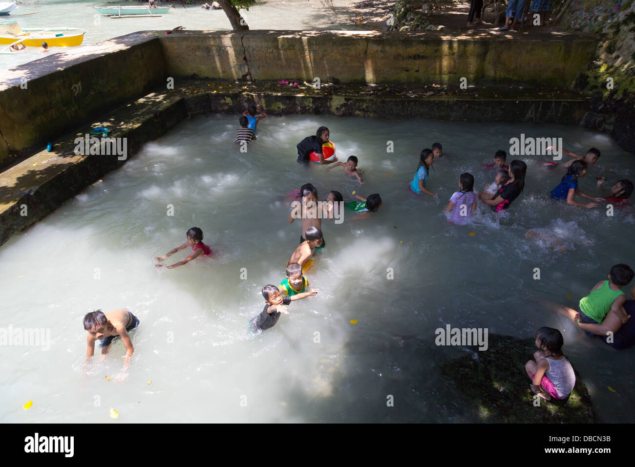 Young boy bathing in pool hi-res stock photography and images - Alamy
