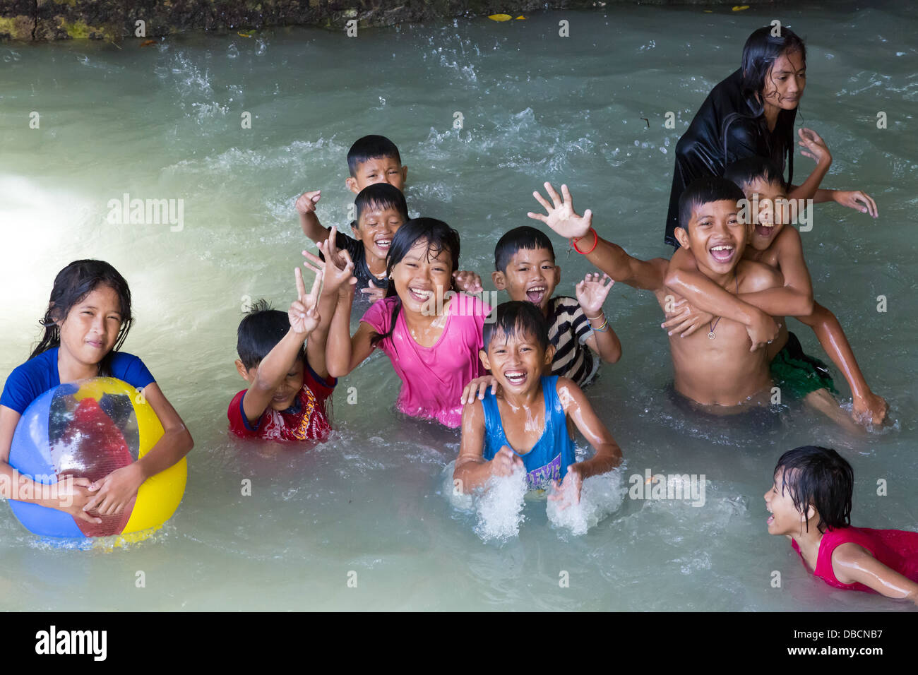 Young local Children enjoying a Bath in a Pool in Tagbilaran on Bohol ...