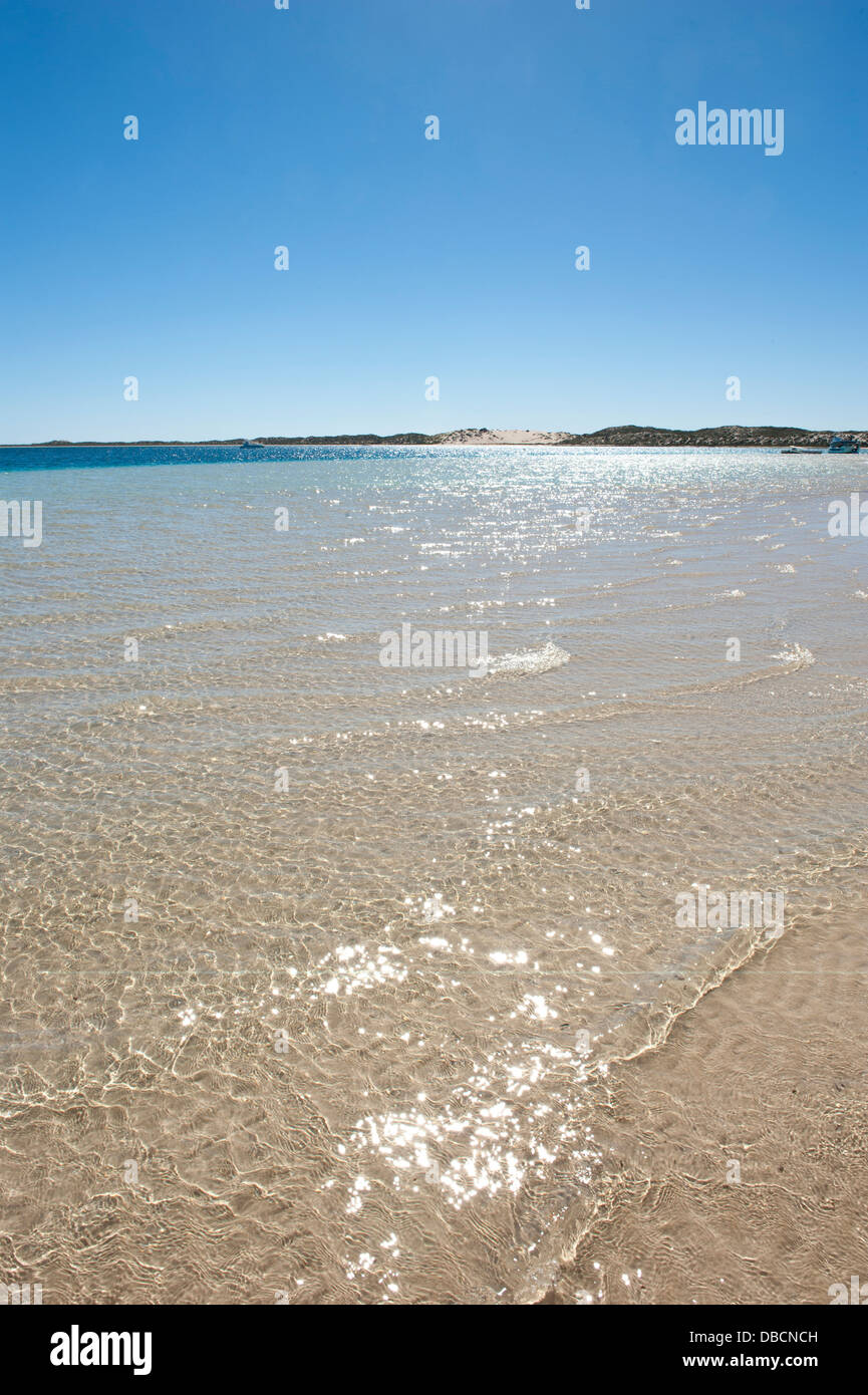 The white beach and turquoise waters of Coral Bay, a popular holiday ...