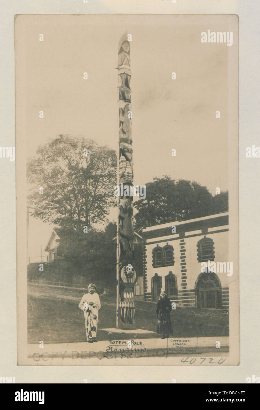 The image shows a traditional totem pole from Nanaimo, British Columbia ...