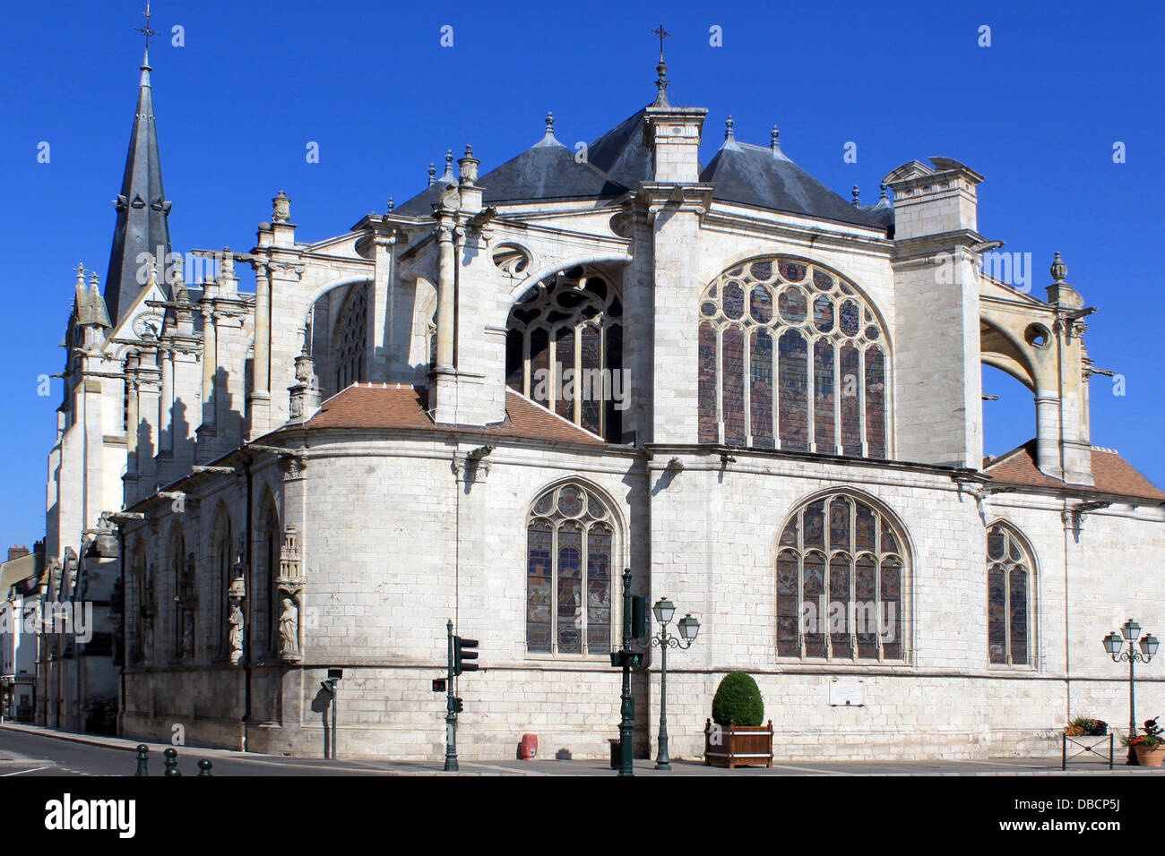 a Gothic Catholic church with its bell tower on blue sky background ...