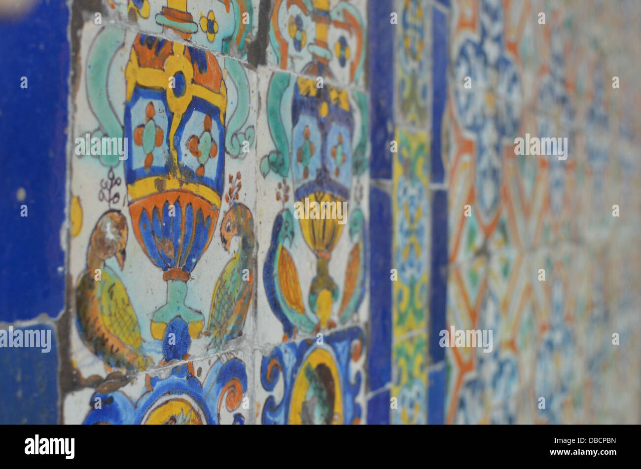 Elaborate hand painted tiles along the courtyard of the Santo Domingo ...