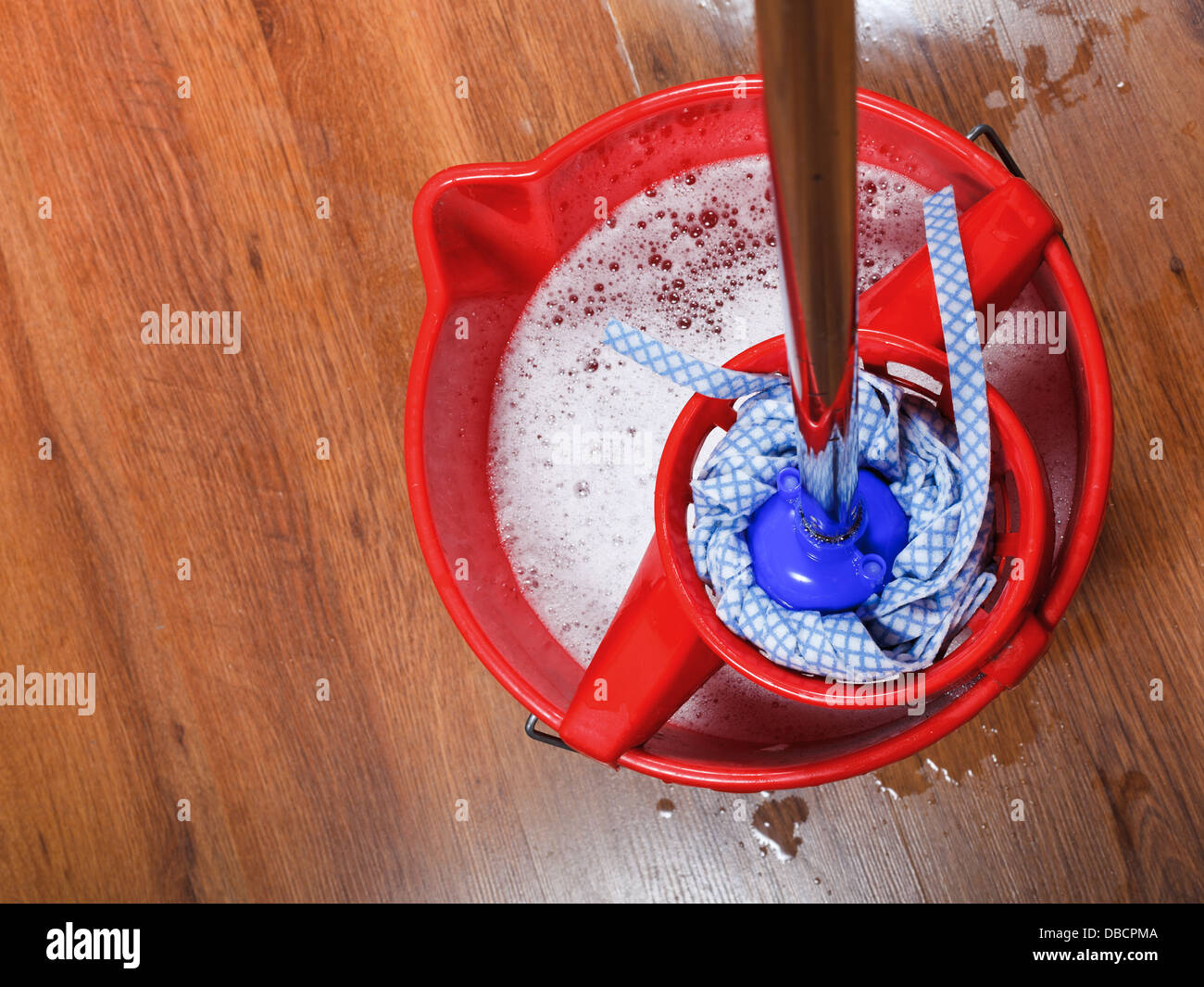 top view of mop in bucket with water for housework Stock Photo - Alamy