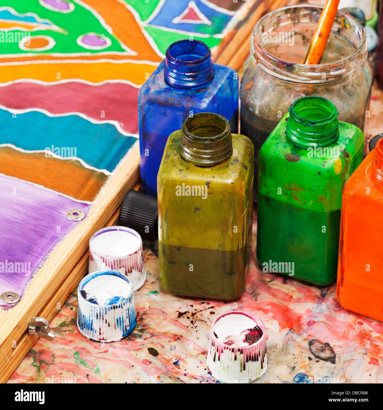 paintbrush and bottles with dyes for cold batik Stock Photo - Alamy