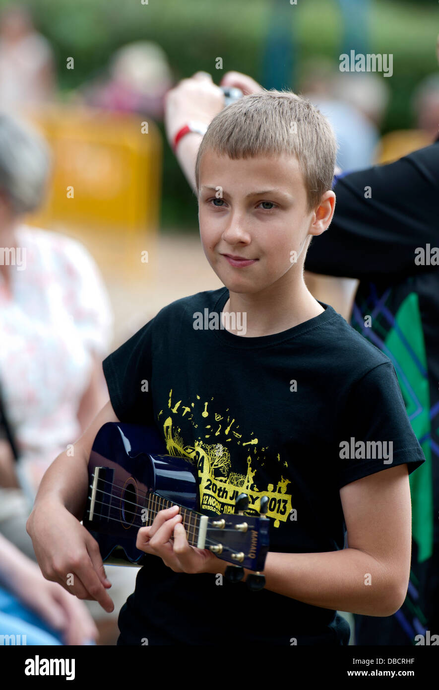 Boy playing musical instruments hi-res stock photography and images - Alamy