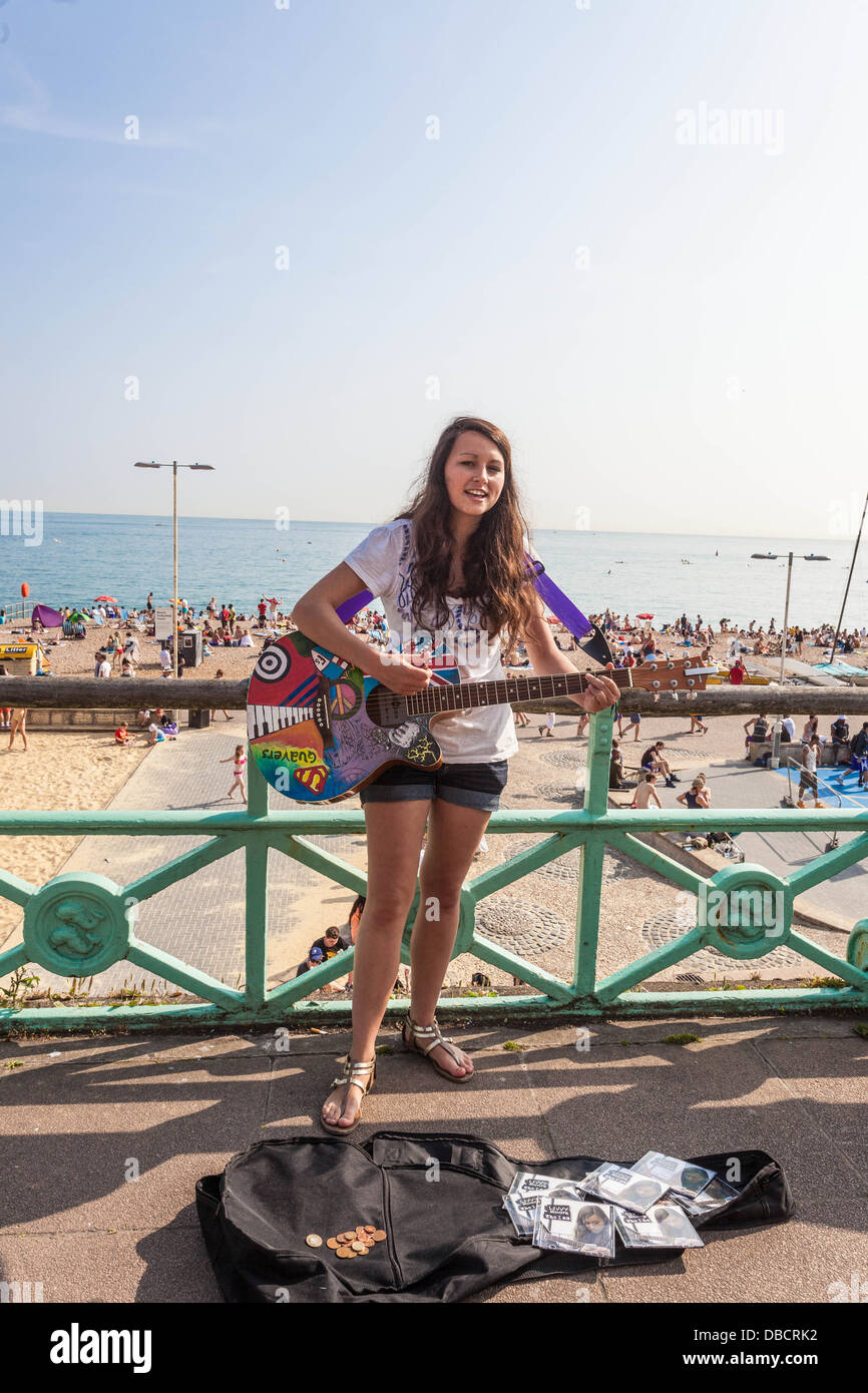 Singer songwriter Livvy Moore busking at the seafront in Brighton ...