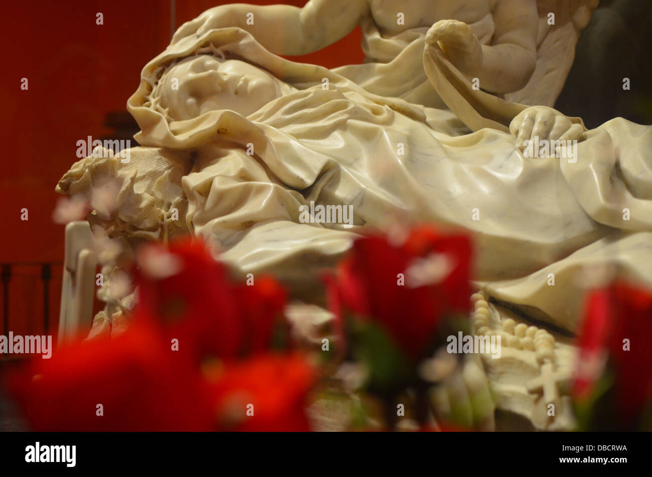 Statue of Santa Rosa de Lima, with roses in the foreground. Convent of ...