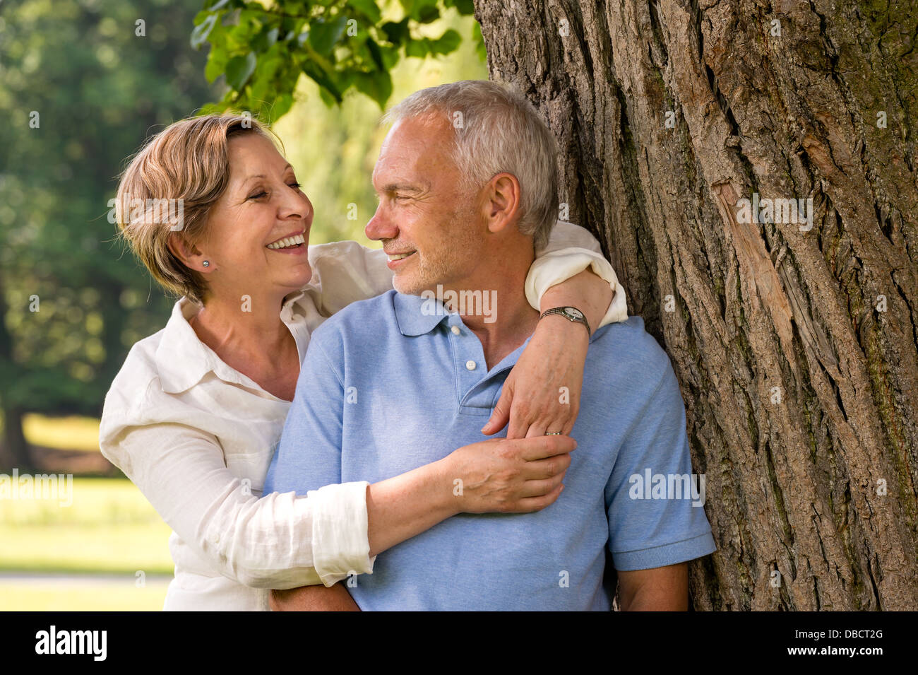at each other,caucasian,cheerful,closeup,couple,cuddling,elderly ...
