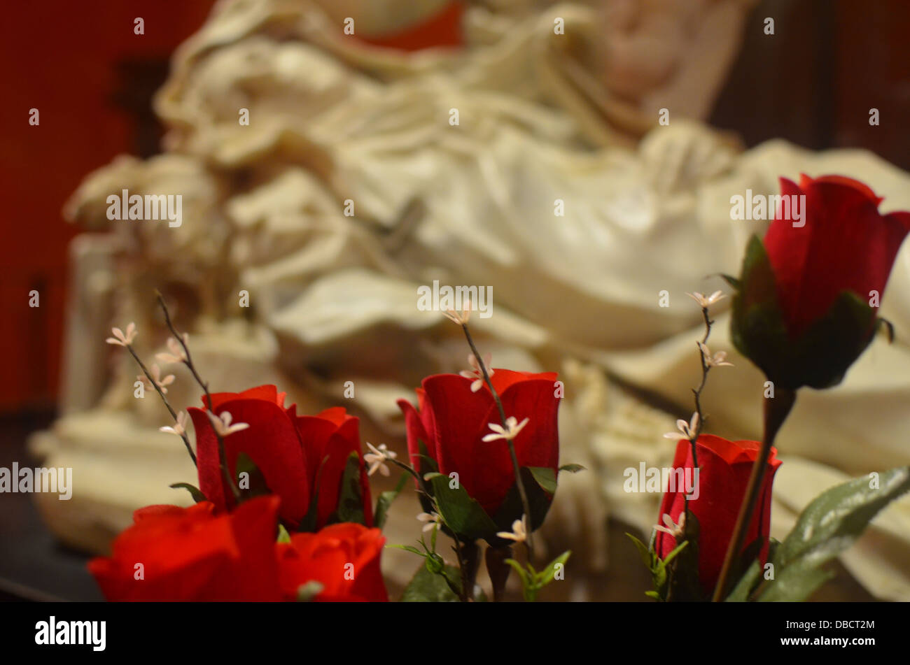 Statue of Santa Rosa de Lima, with roses in the foreground. Convent of ...