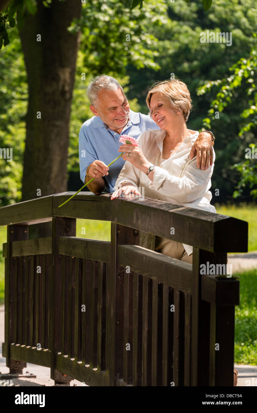 at each other,bridge,caucasian,cheerful,couple,cuddling,dating,elderly ...