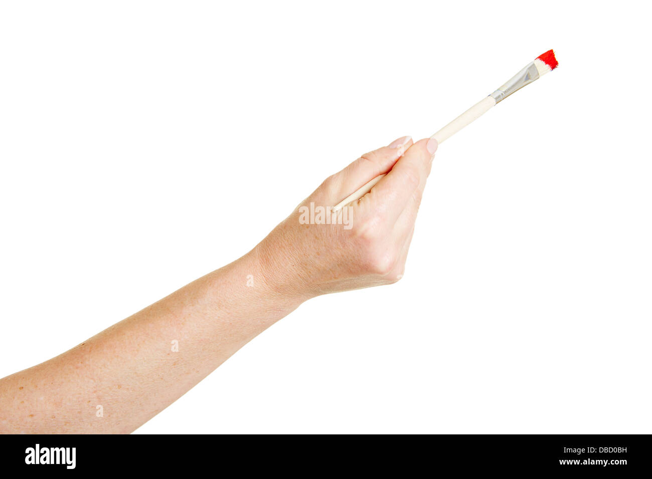 A female hand with brush painting red Stock Photo - Alamy
