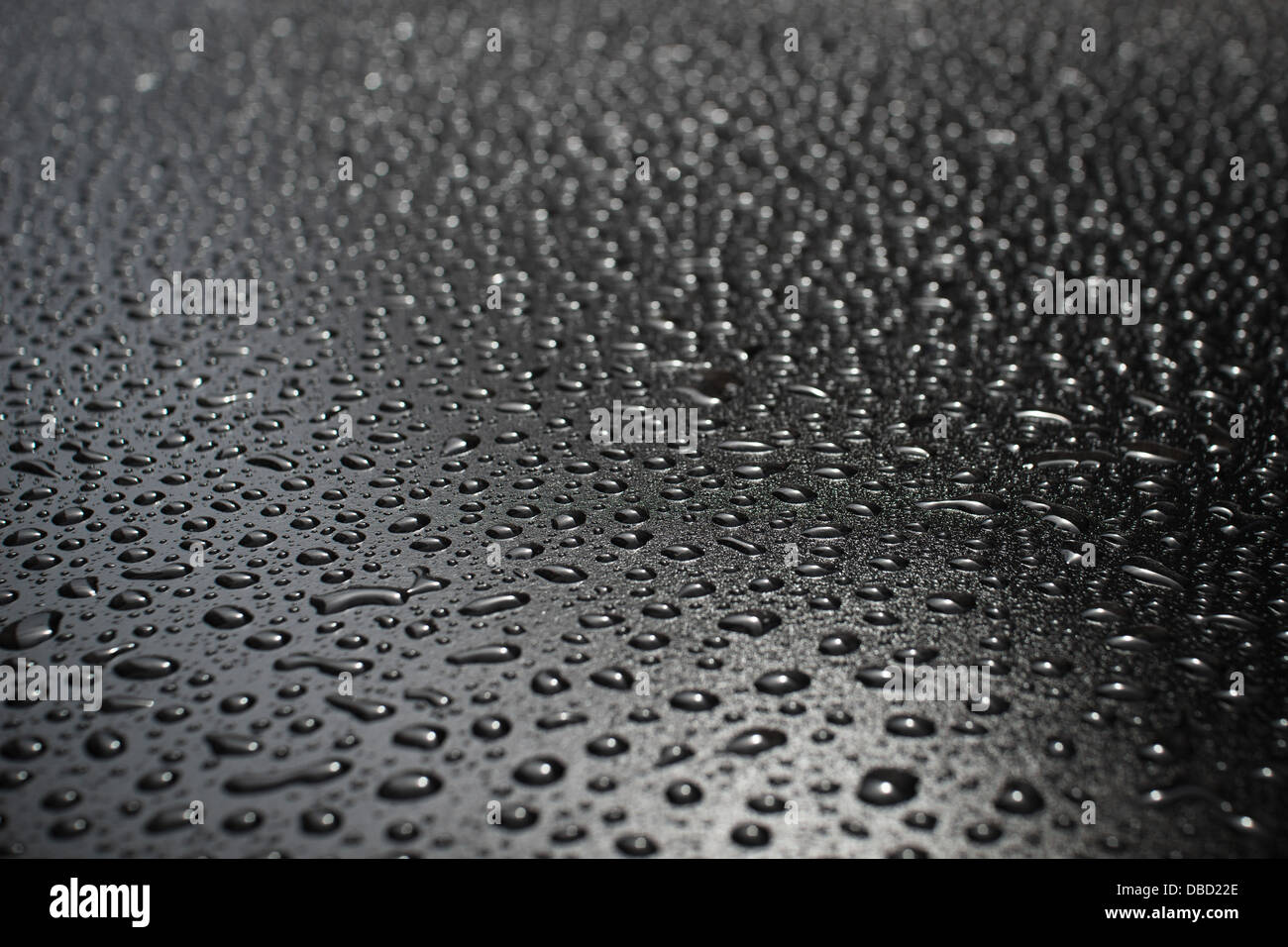 Waterdrops on black surface Stock Photo - Alamy