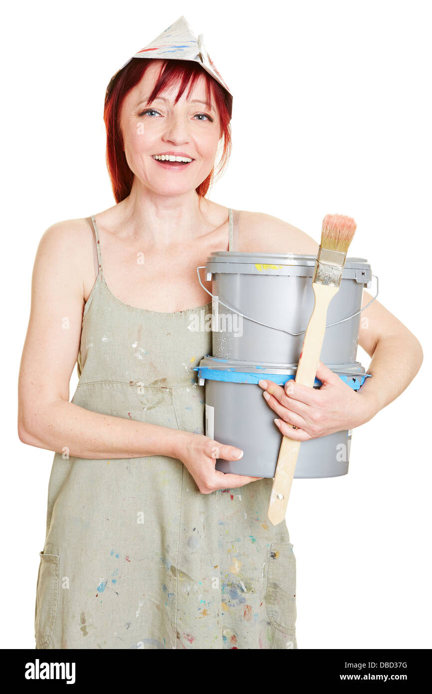 Woman holding paint buckets and brush for renovation Stock Photo - Alamy