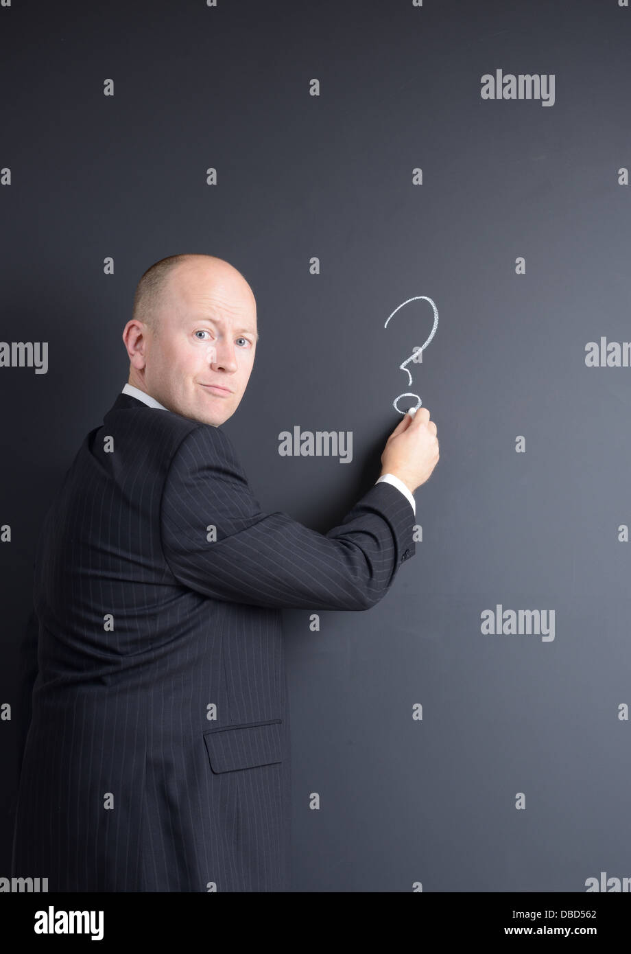 concept the question and answer session businessman in front of chalk ...