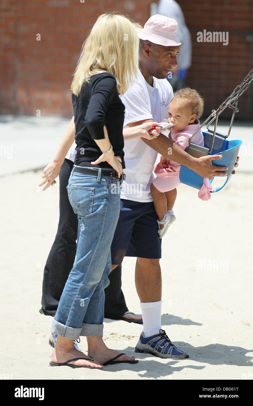 Byron Allen and his wife, Jennifer Lucas enjoy the day playing at ...