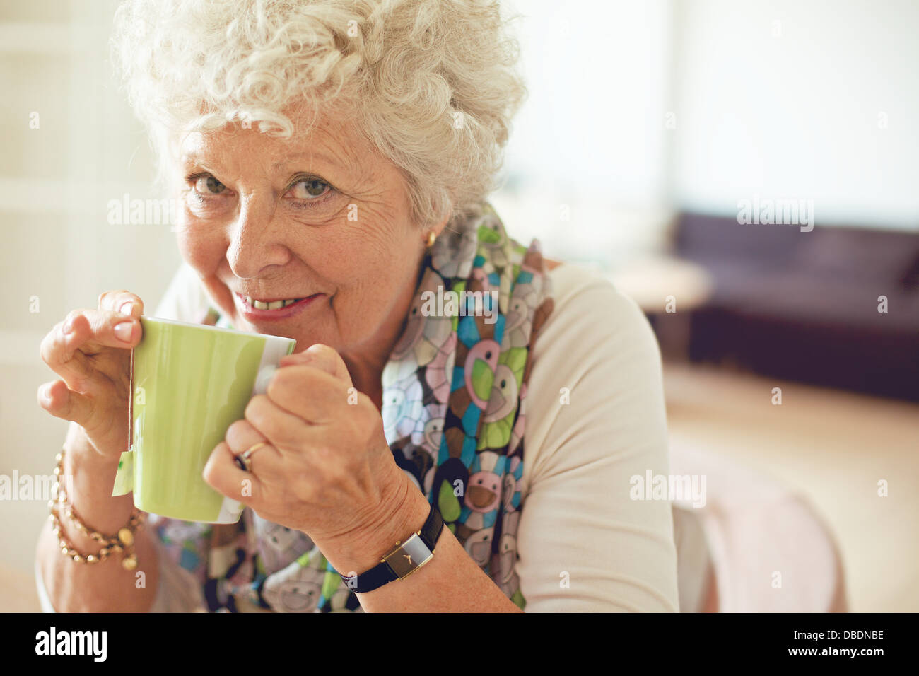Mature lady drinking tea hi-res stock photography and images - Alamy