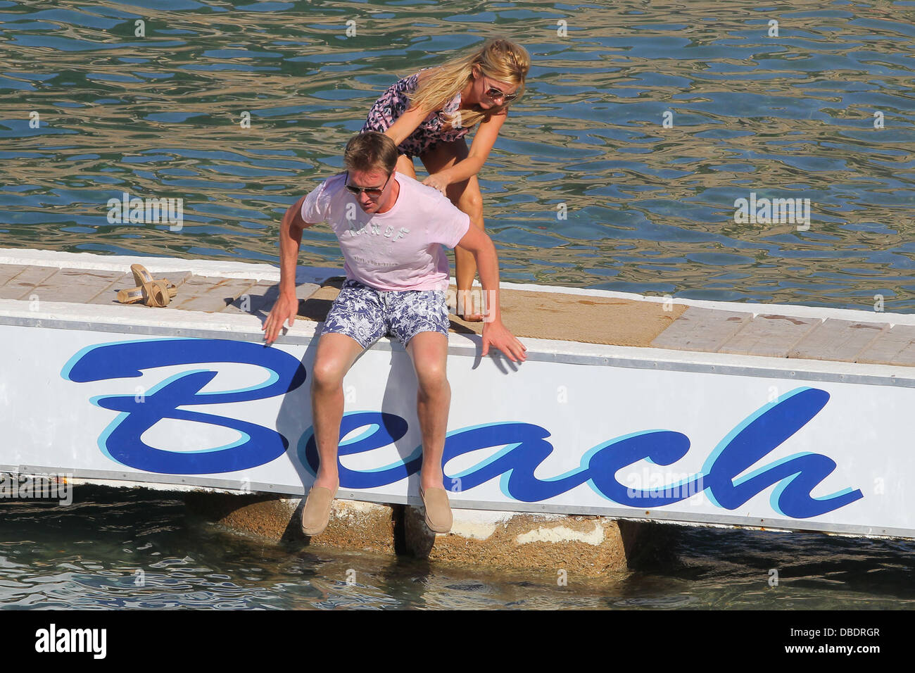 Geri Halliwell and Henry Beckwith relax by the water after attending ...