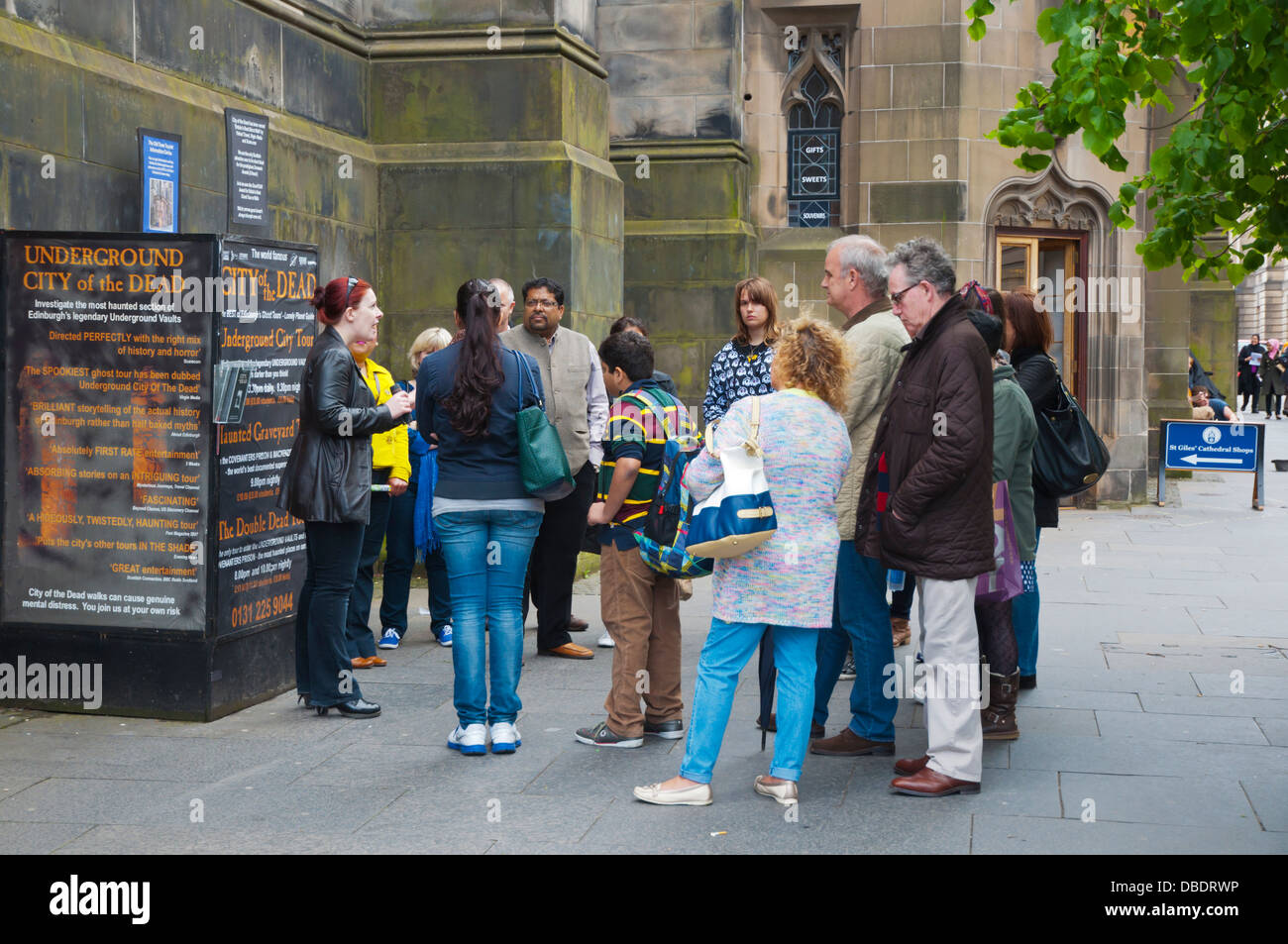 Tour guide with a tour group Royal Mile old town Edinburgh Scotland ...