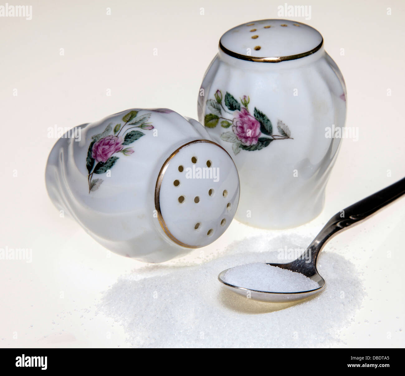 Spoon full of Salt with Salt Shaker on white isolated background Stock ...