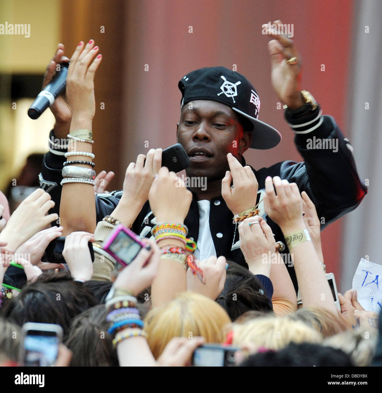 Dizzee Rascal performing at the "Coca- Cola London 2012 Olympic Torch ...