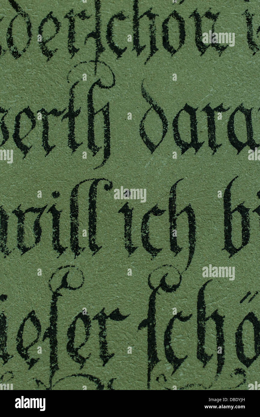 A photograph of some ancient German text on a concrete wall Stock Photo ...